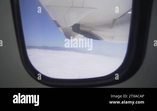 The view from the window - an airplane wing and a turbo engine in ...