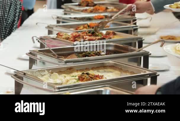 People group catering buffet food indoor in luxury restaurant with meat ...