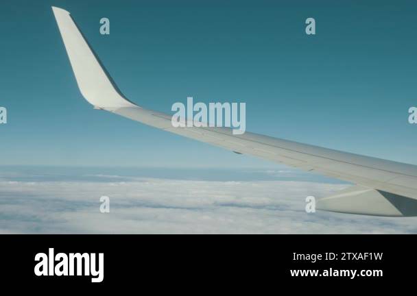 Airplane flight. View through the window of an airplane of the wing and ...
