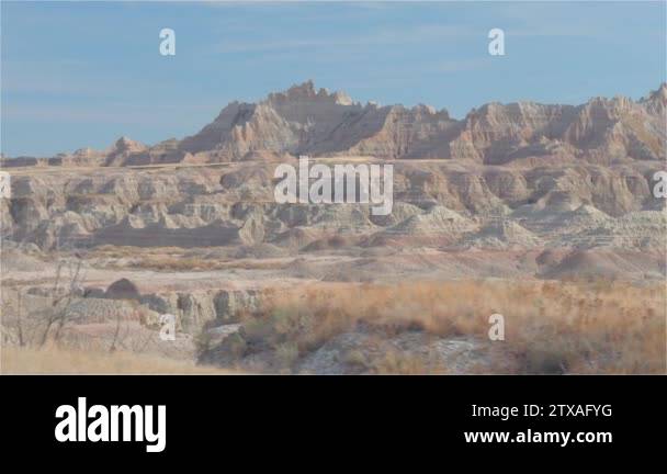 Beautiful endless sandstone formations and dry grass prairie at ...