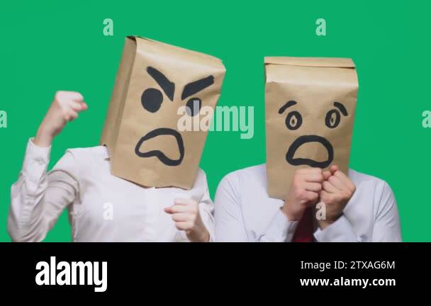 The concept of emotions and gestures. Two people in paper bags with ...