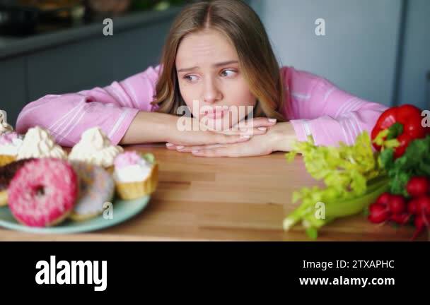 Young woman sad food Stock Videos & Footage - HD and 4K Video Clips - Alamy
