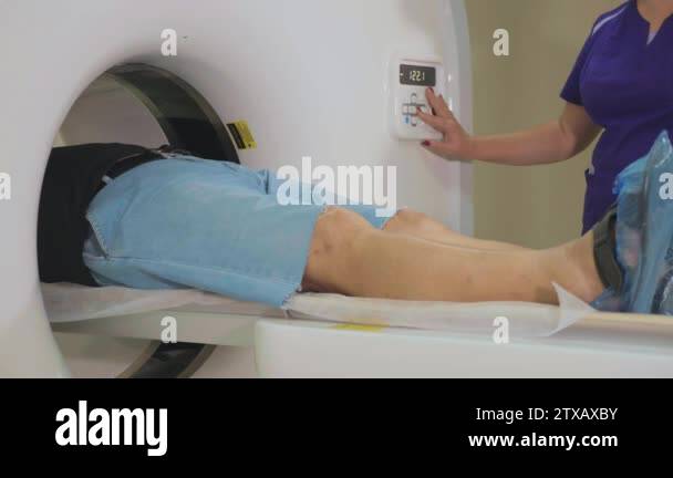 Elderly patient is scanned by MRI, CT scanner at modern hospital Stock ...