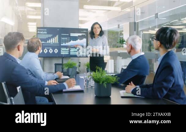 Chief Female Executive Gives a Report/ Presentation to Her Colleagues ...