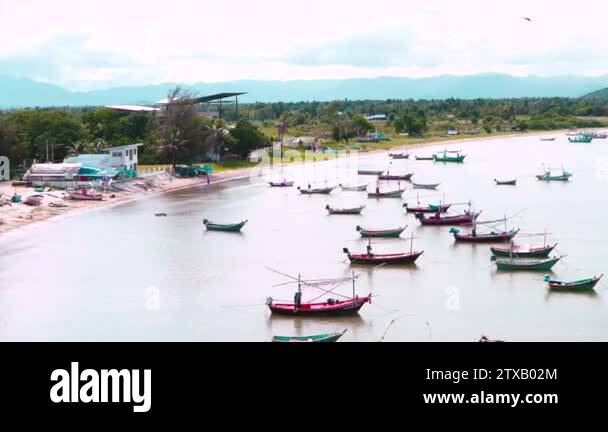 beautiful bay with many local fishing boats floating in the sea in ...