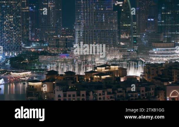 Dubai Downtown skyline at night with fountain and towers paniramic view ...