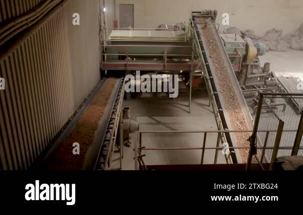 Machines working and conveyor line transporting sand. Conveyor belt on ...