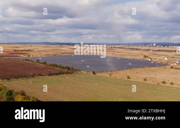 Dolly zoom aerial view of Solar Panels Farm (solar cell) with sunlight ...