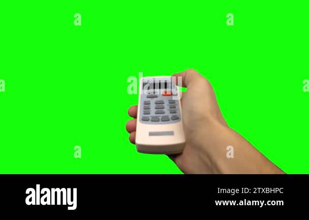 Male hand pushing temperature button on air conditioner remote control ...