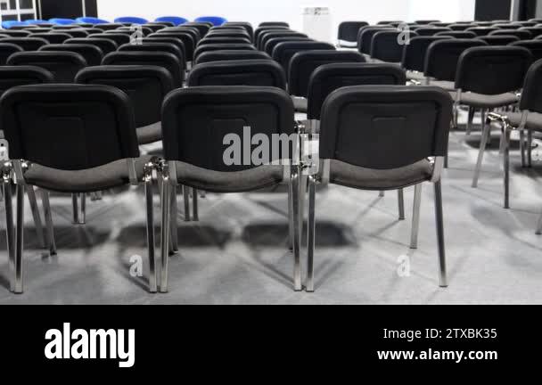 Slow panning shot shows big auditorium for conferences or meetings ...