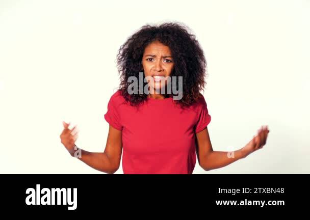 Angry annoyed woman raising hand up to say what. Misunderstanding ...