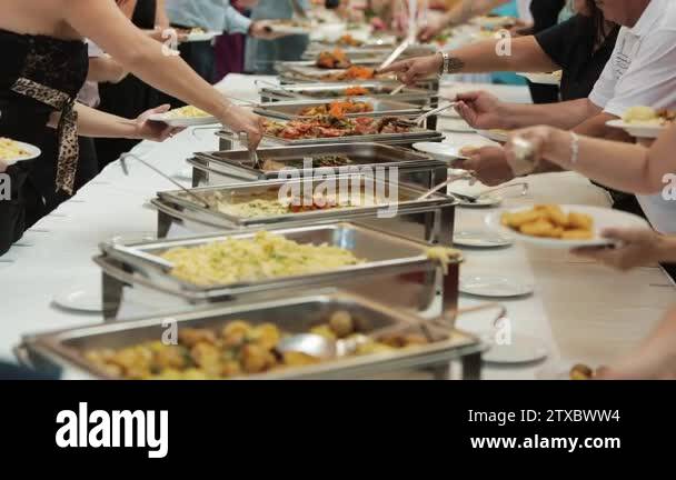 People group catering buffet food indoor in luxury restaurant with meat ...