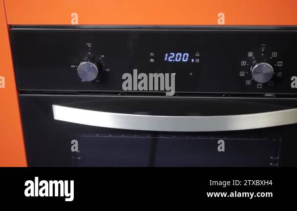 Metallic Toggle Switch of the Cooker Oven. Close-up View. Digital Clock ...