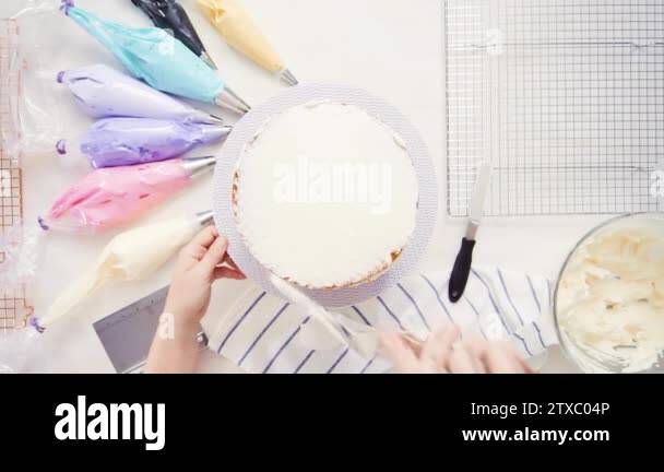 Step by step. Top view. Pastry chef stacking cake layers with ...