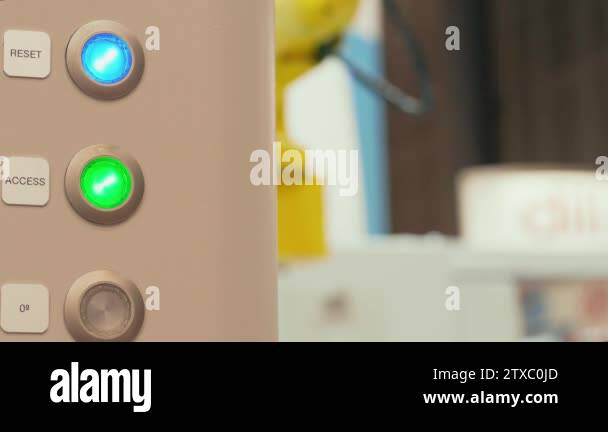 Panel with reset blue and green access illuminated buttons of light ...