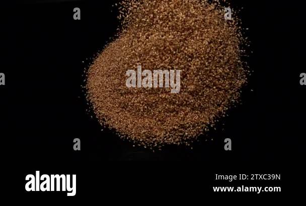 Gold Coloured Sesam, sesamum indicum, Seeds Exploding against Black ...