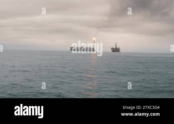 FPSO tanker vessel near Oil Rig platform. Offshore oil and gas industry ...