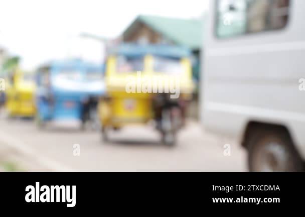 blur view of people walking and riding motorbikes traffic jam center ...