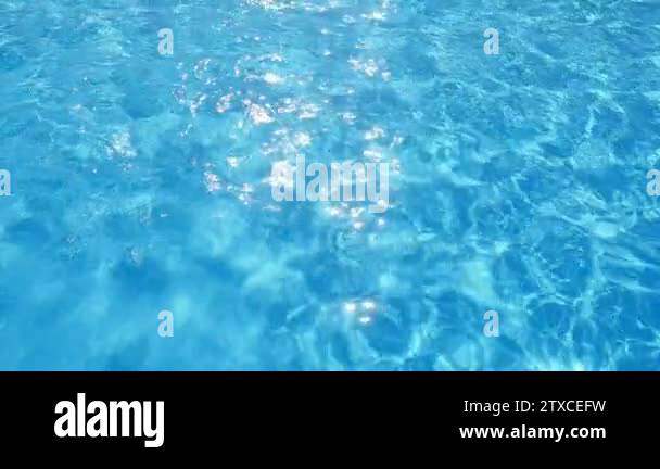 Magic swimming pool shining with its alive see-through sky blue waters ...