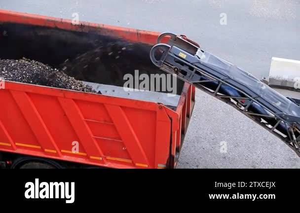 the work of road machinery when repairing a highway, the loading of cut ...