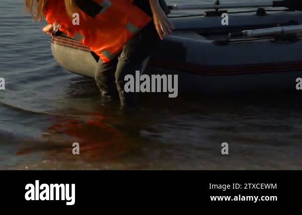 Exhausted female with lifeboat getting land, shipwreck survived victim ...