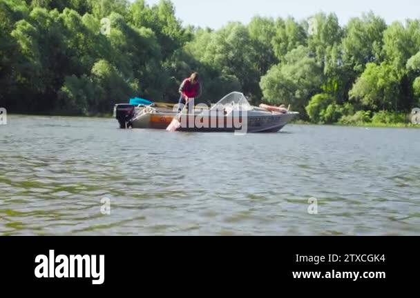 A scientist drops a plankton catching device into the water Stock Video ...