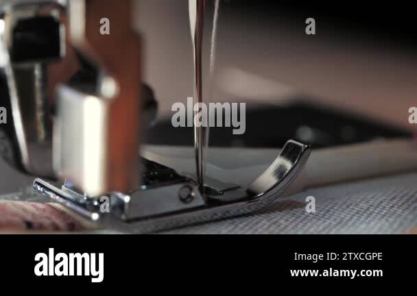 Close up of sewing machine showing process. Item of clothing, vintage ...