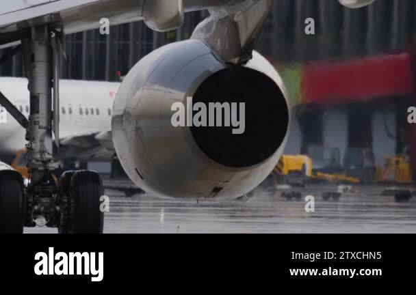 Back view of working jet engine of taxiing aircraft. Sheremetyevo ...