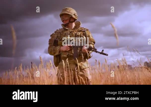 Authentic soldier in military clothes and helmet standing still and ...