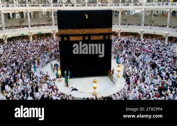 Muslim pilgrims get ready to perform evening prayer facing the Kaabah ...