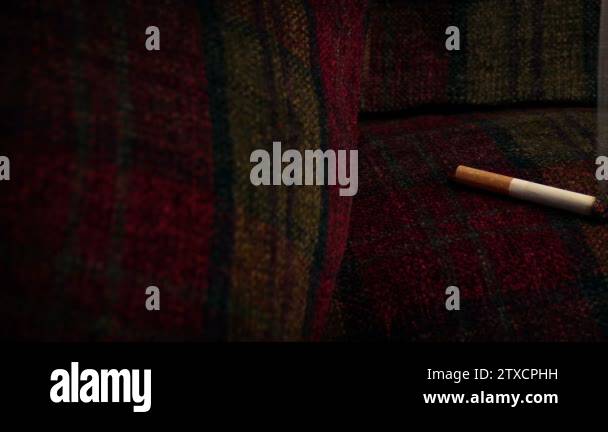 Cigarette Burning Sofa - Fire Hazard Concept Stock Video Footage - Alamy