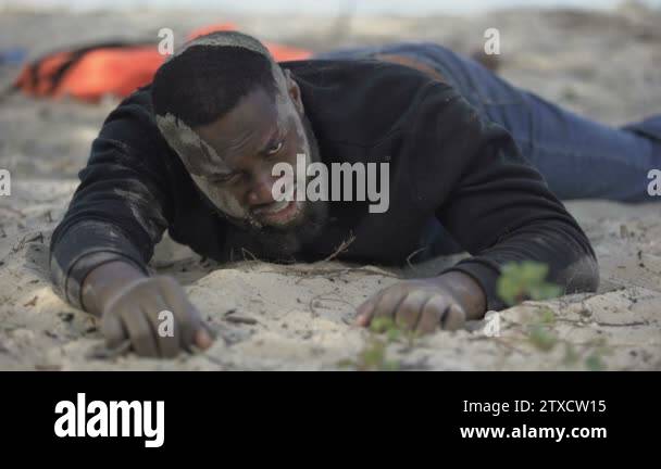 Desperate afro-american man crying on shore, victim of crash, natural ...