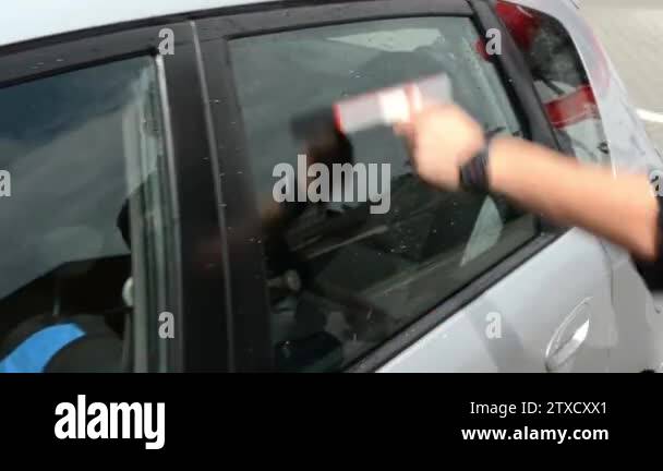 Man washing car window with window cleaner Stock Video Footage - Alamy