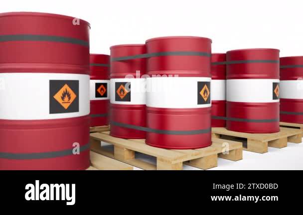 A lot of red and white metal barrels with a flammable symbol on body ...