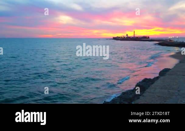 Enjoy the cloudy sunset over Atlantic Ocean with a view on tidal waves ...