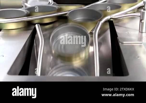 Empty cans in the production process pass through the production line ...