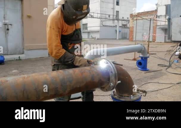 Welding pipe. Welder worker welding pipe by electrode. Electrodes for ...