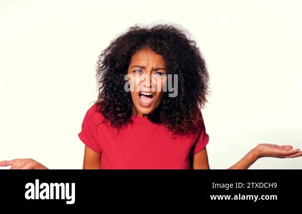 Angry annoyed woman raising hand up to say what. Misunderstanding ...