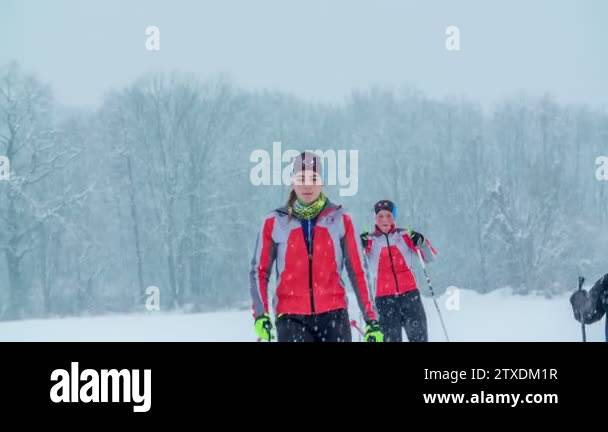 Young people are cross-country skiing on a cold winter day. It's also ...