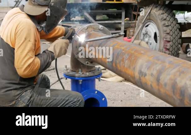 Welding pipe. Welder worker welding pipe by electrode. Electrodes for ...