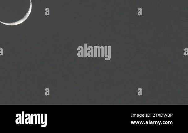 Old thin moon on dark sky background Stock Video Footage - Alamy
