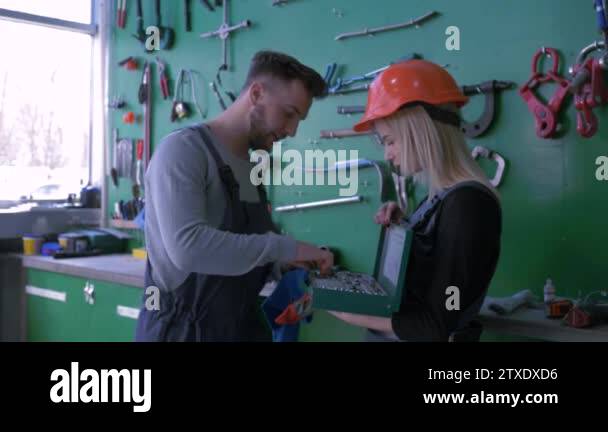 internship in car service station, professional mechanic teaches young ...