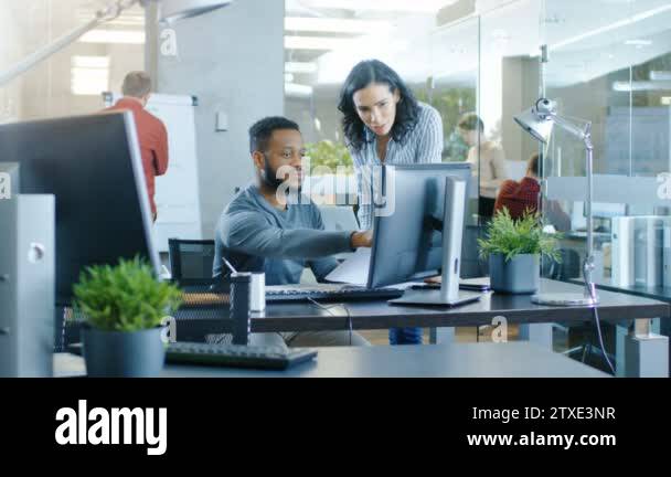 In the Busy Corporate Office Male and Female Together Solve Work ...