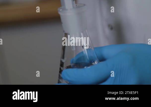 Scientist with a syringe conducts experiments Stock Video Footage - Alamy