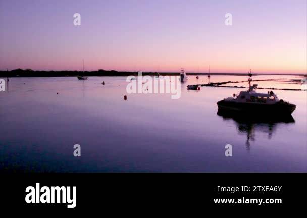 Dusk in Quatro-Aguas Recreational Port and ferry boat pier to Tavira ...