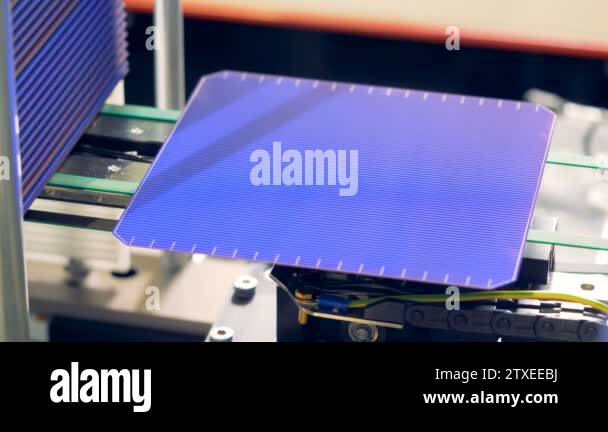 Solar module cells being released and moving along the conveyor belt ...