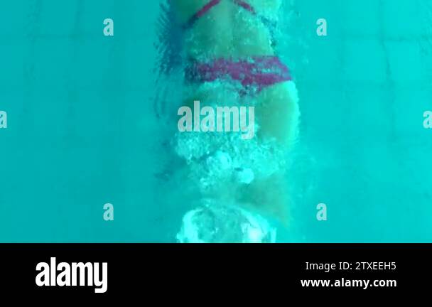 Girl Swimmer Dive In Swimming Pool. Female swimmer dives in swimming ...