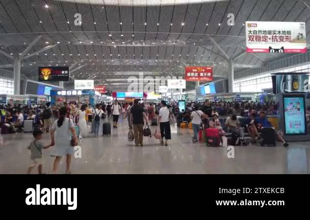 Xian, China - July 2019 : Crowds of Chinese people inside Xian modern high speed rail train ...