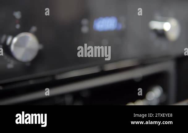 Metallic Toggle Switch of the Cooker Oven. Close-up View. Digital Clock ...