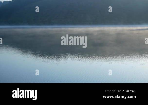 Fog spreads over the water.Panorama (from left to right) over the fog ...